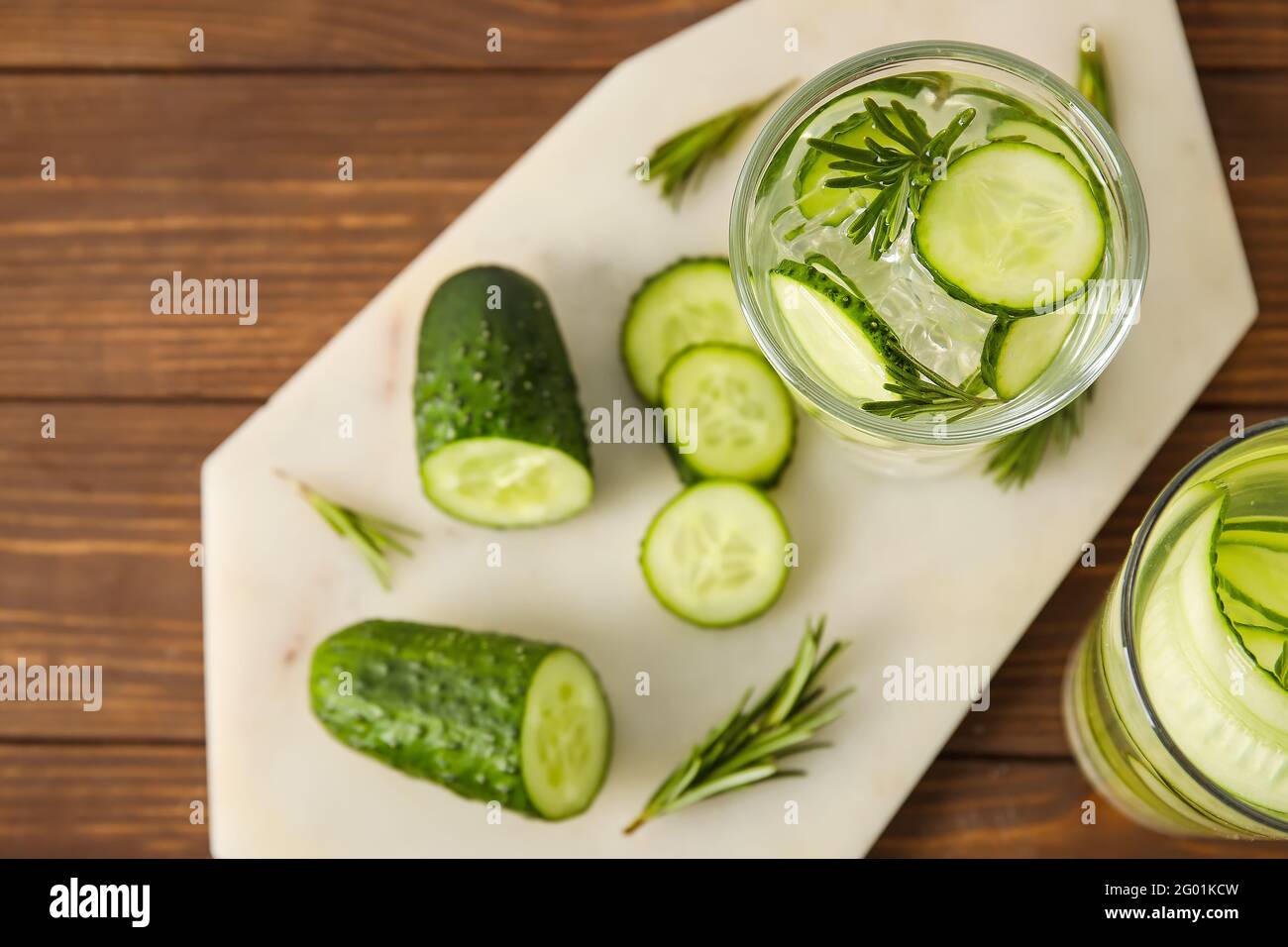 Glasses with cucumber lemonade on wooden background Stock Photo - Alamy
