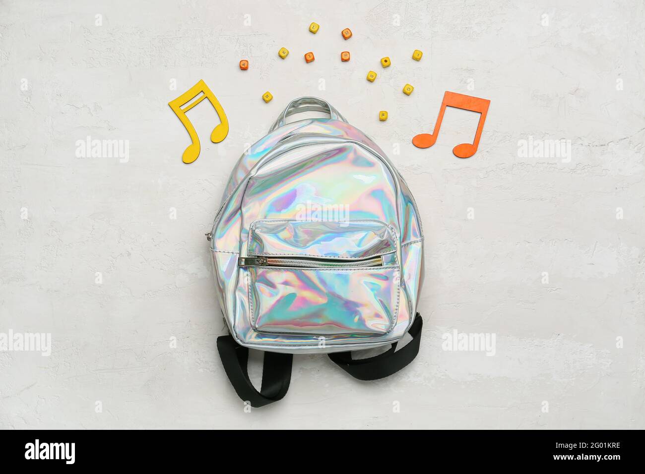 School backpack and music notes on light background Stock Photo - Alamy