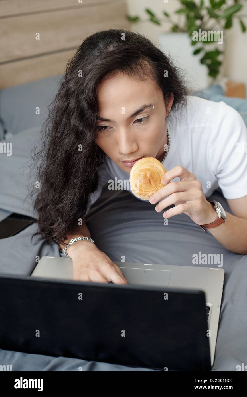 Asian freelancer using laptop hi-res stock photography and images - Alamy