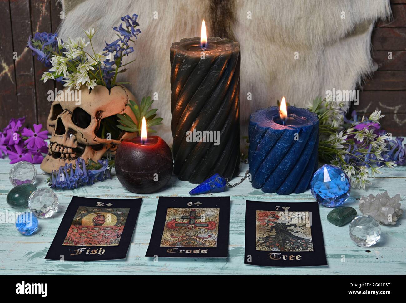 Still life with tarot cards, burning candles and magic objects on witch ...