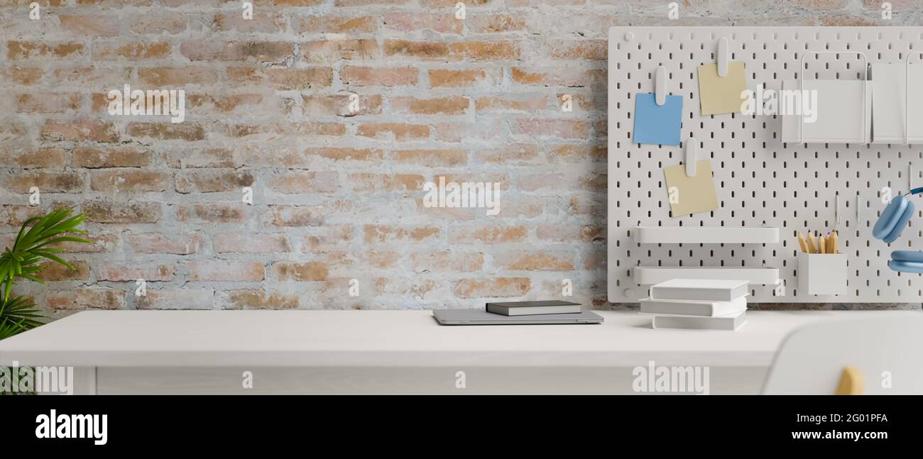 Contemporary working space with laptop, books, stationery and supplies ...