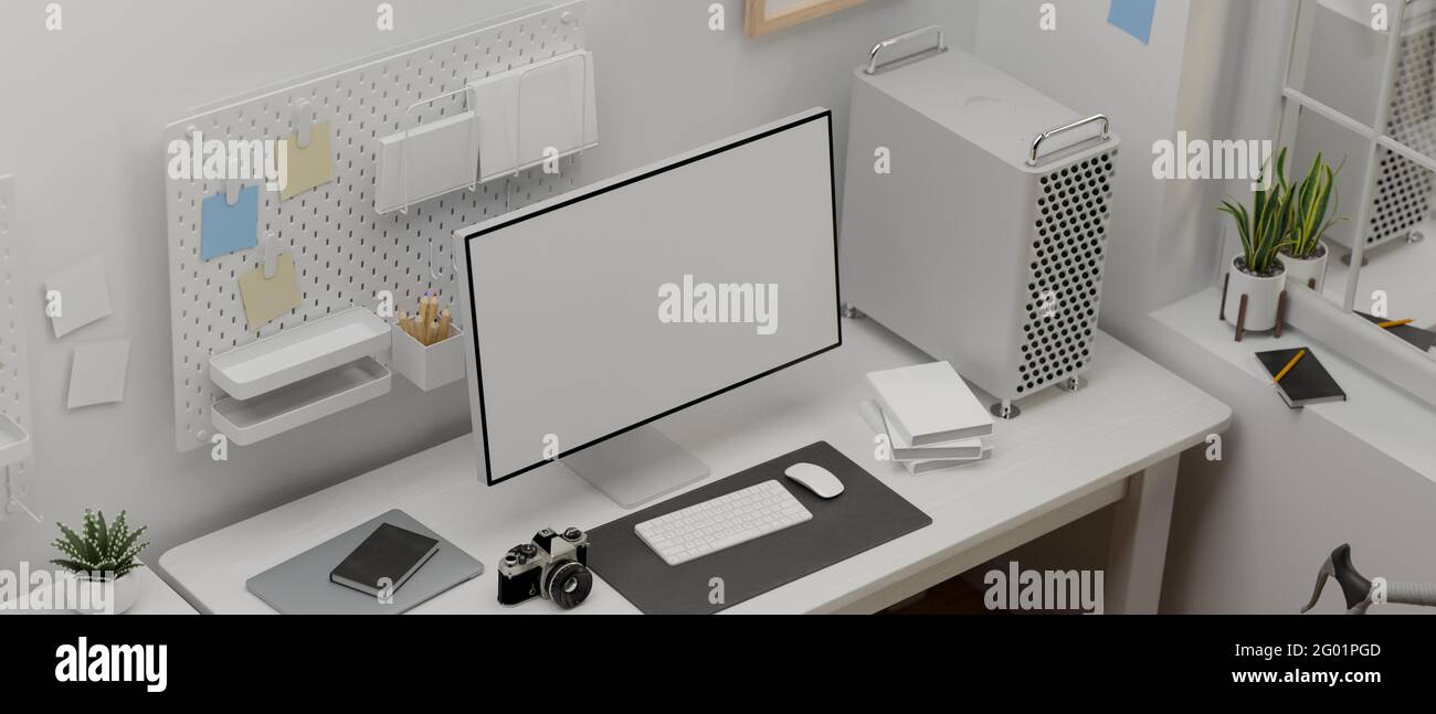 Top view of computer device with mock-up screen on white table in ...