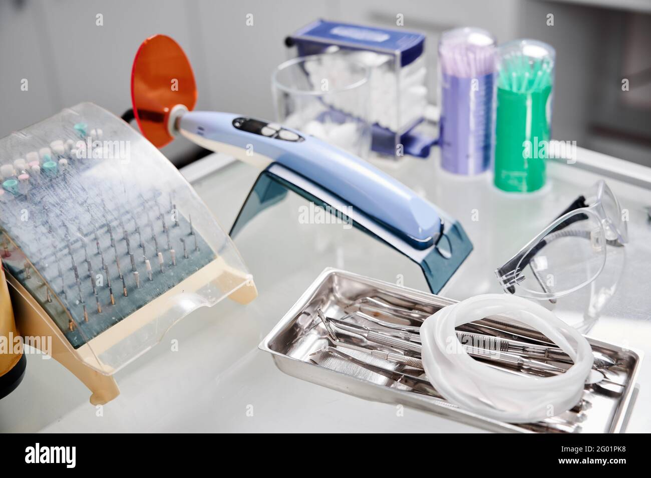 Close-up snapshot of dental instruments. Glass table in dentist office ...