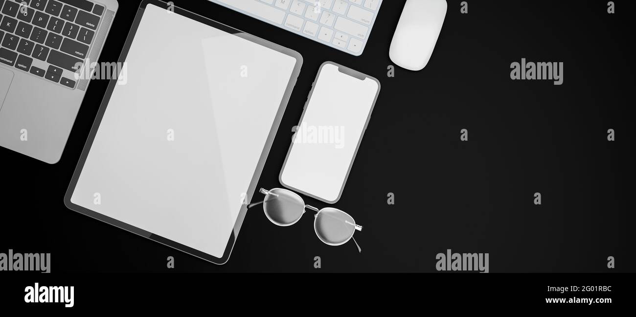 Top view of black table with digital devices with mock-up screen and ...