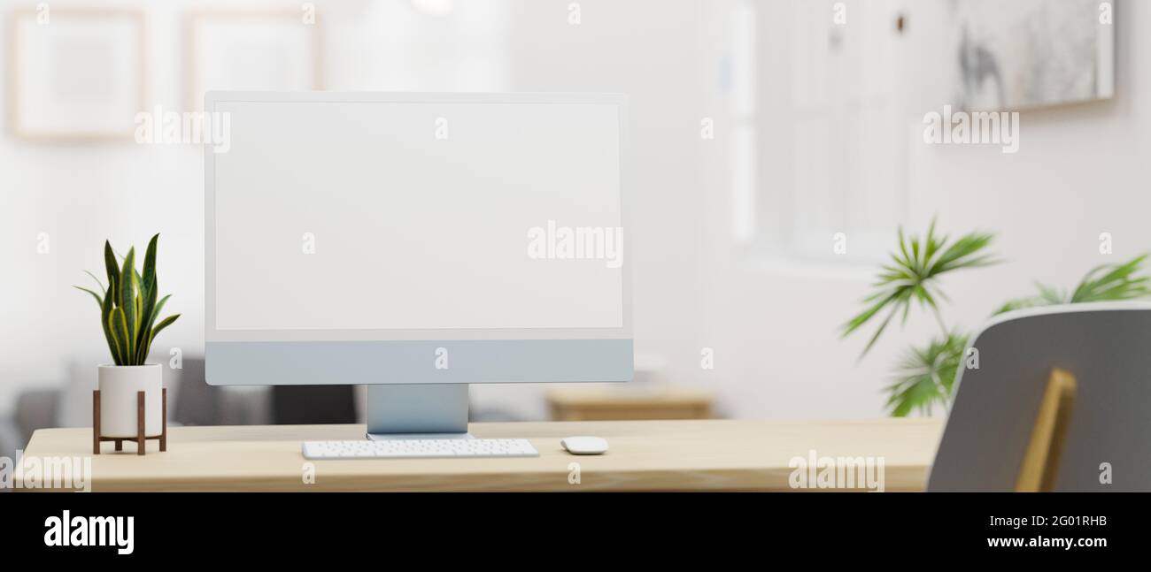 Blue pastel computer monitor with mock-up screen on the table in office ...