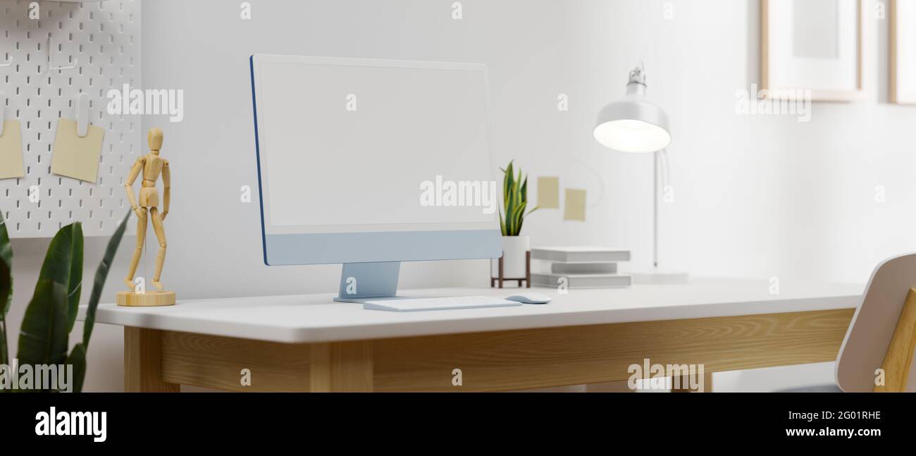 Blue pastel computer monitor with mock-up screen on white table in ...
