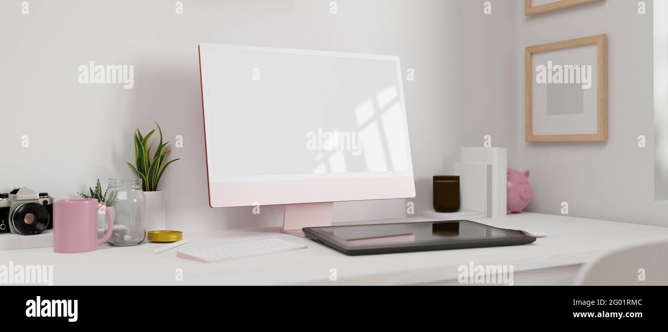 Pink pastel computer monitor with mock-up screen, drawing tablet and ...