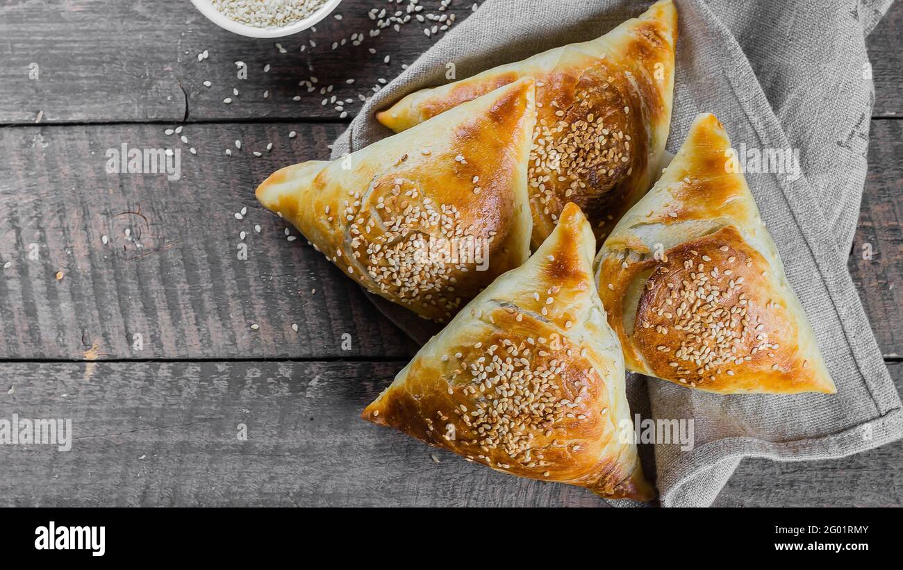 Delicious samosas samsa with meat on wooden table background, top view ...
