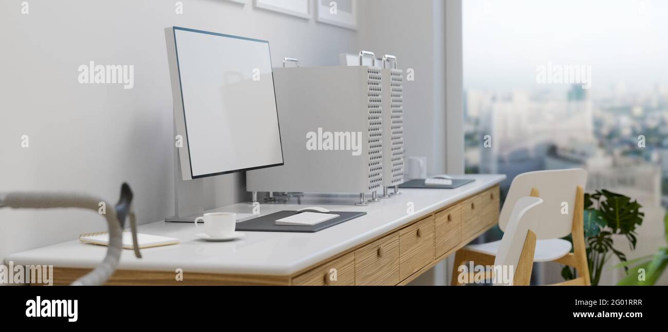 Side view of computer device on the desk beside panoramic window in ...