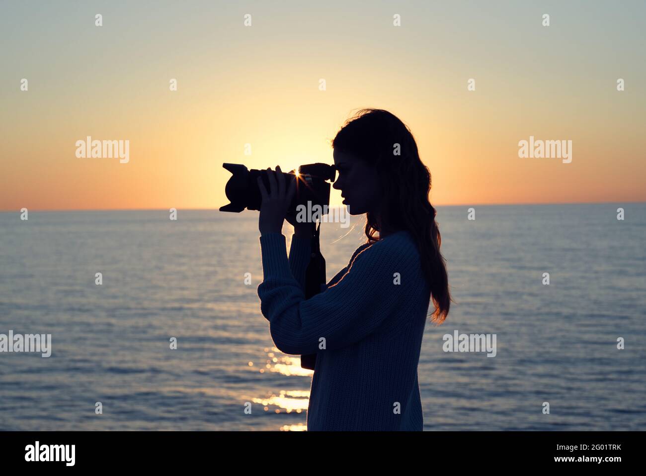 woman photographer with professional camera landscape sunset fresh air ...