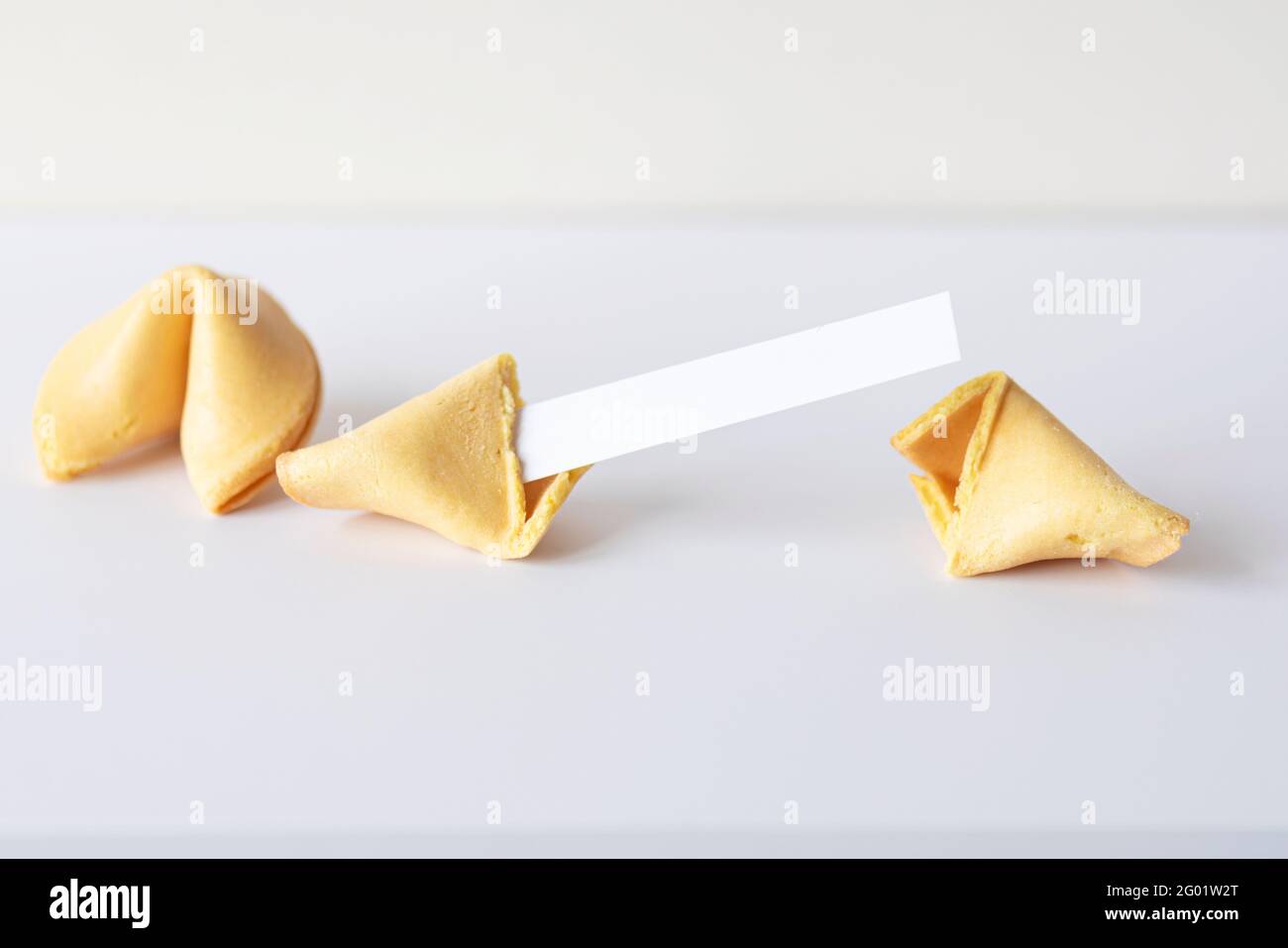 Asian Chinese fortune cookies with blank paper for the text on white ...