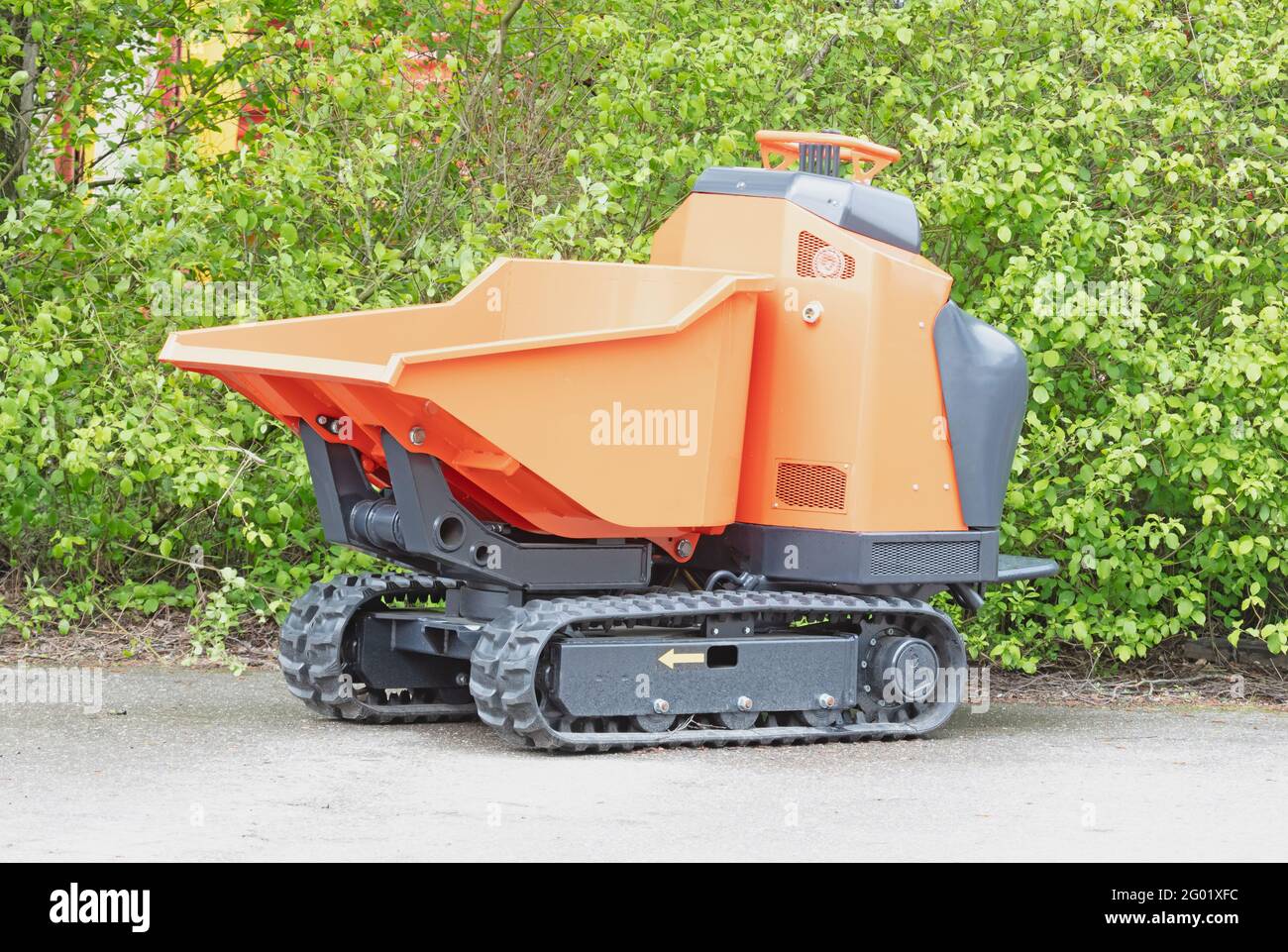 Small vehicle with tracks, orange and new Stock Photo - Alamy