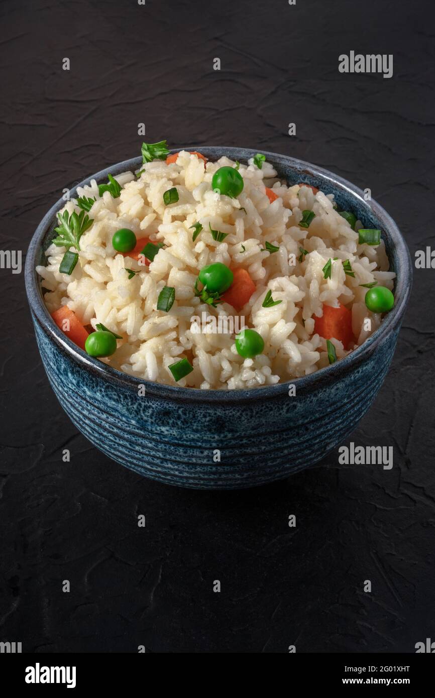 Vegan rice on a dark black background with copyspace Stock Photo - Alamy