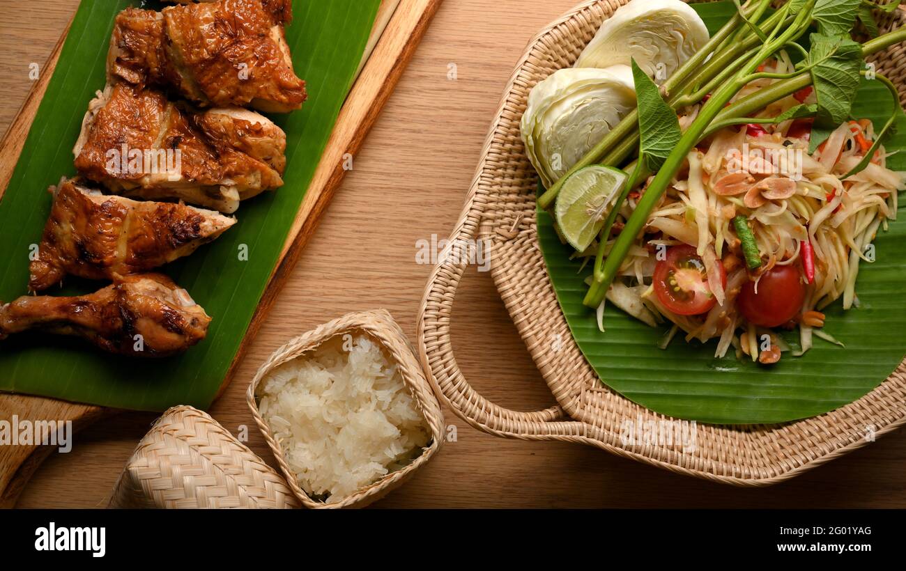 Thai food, papaya salad or Somtum with grilled chicken and sticky rice ...