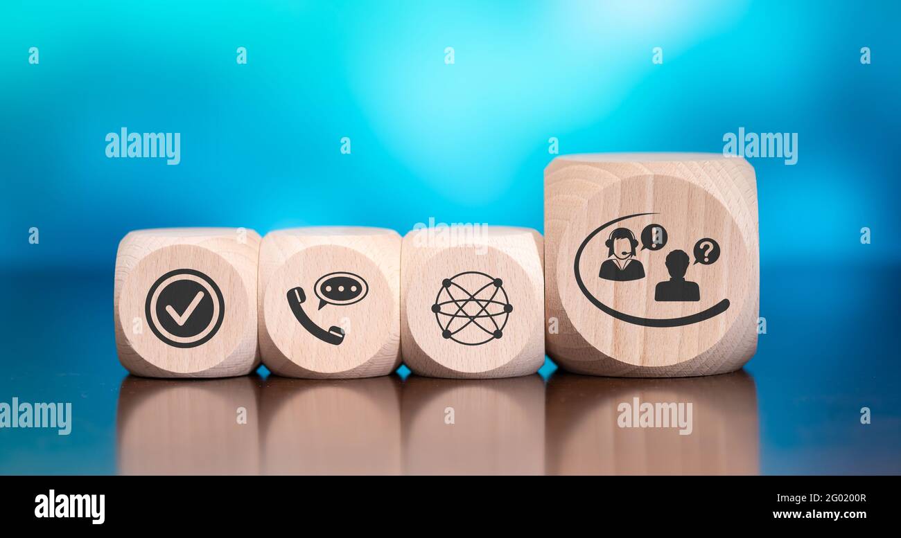 Wooden blocks with symbol of customer support concept on blue ...