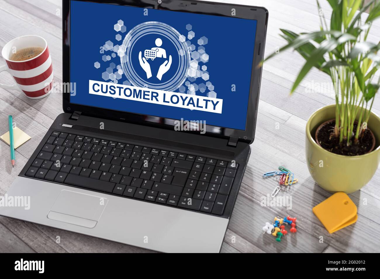 Laptop on a desk with customer loyalty concept on the screen Stock ...