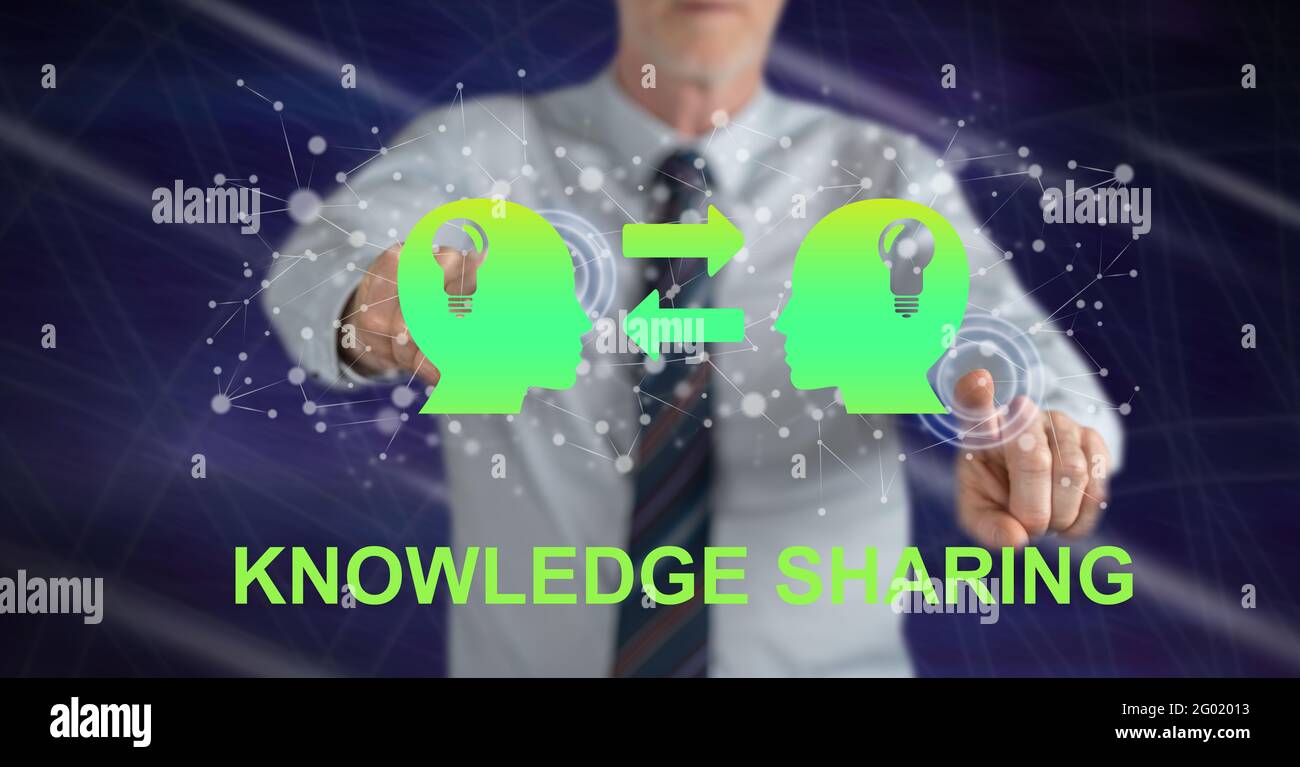 Man touching a knowledge sharing concept on a touch screen with his ...