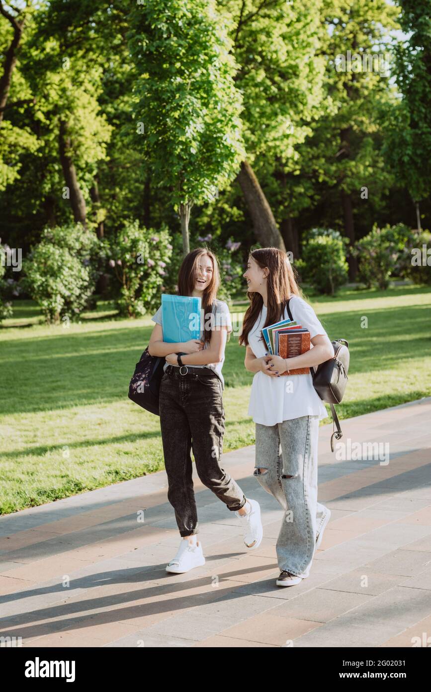 Female student walking into distance hi-res stock photography and ...