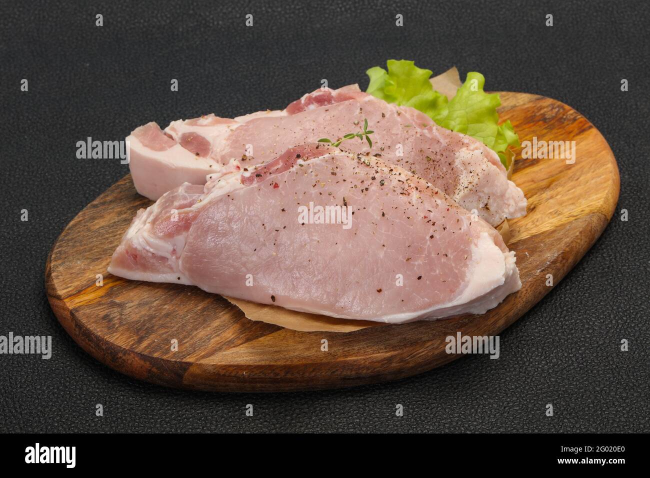 Raw pork meat steak ready for grill Stock Photo - Alamy