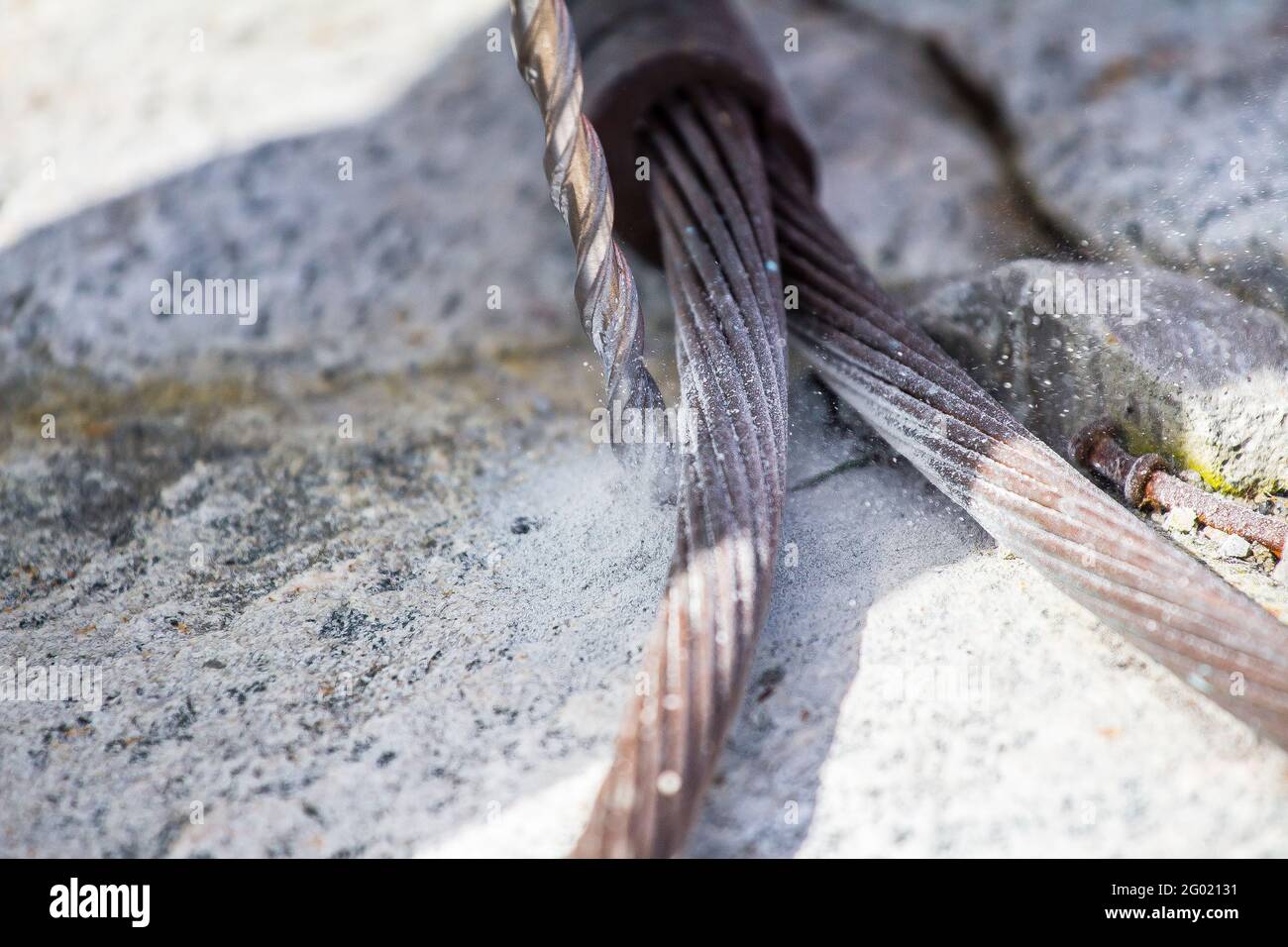 Drill bit and cables on the ground with copy space Stock Photo - Alamy