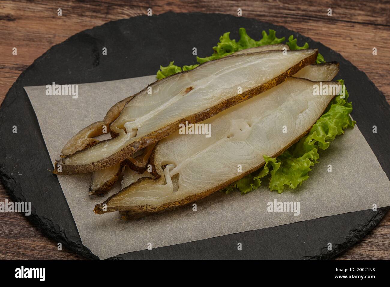 Delicous smoked halibut fish slices snack Stock Photo - Alamy