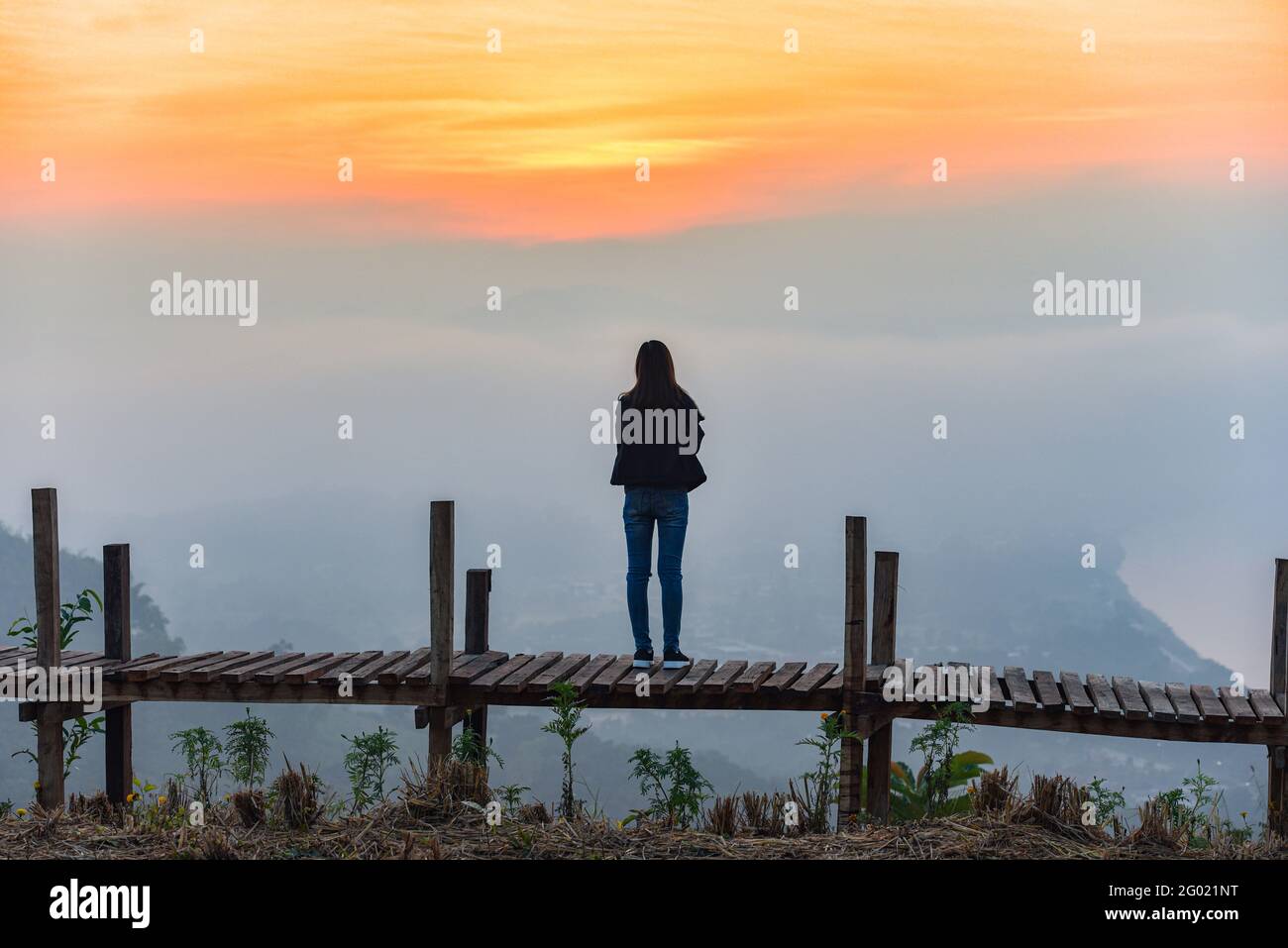Sad woman standing bridge alone hi-res stock photography and images - Alamy