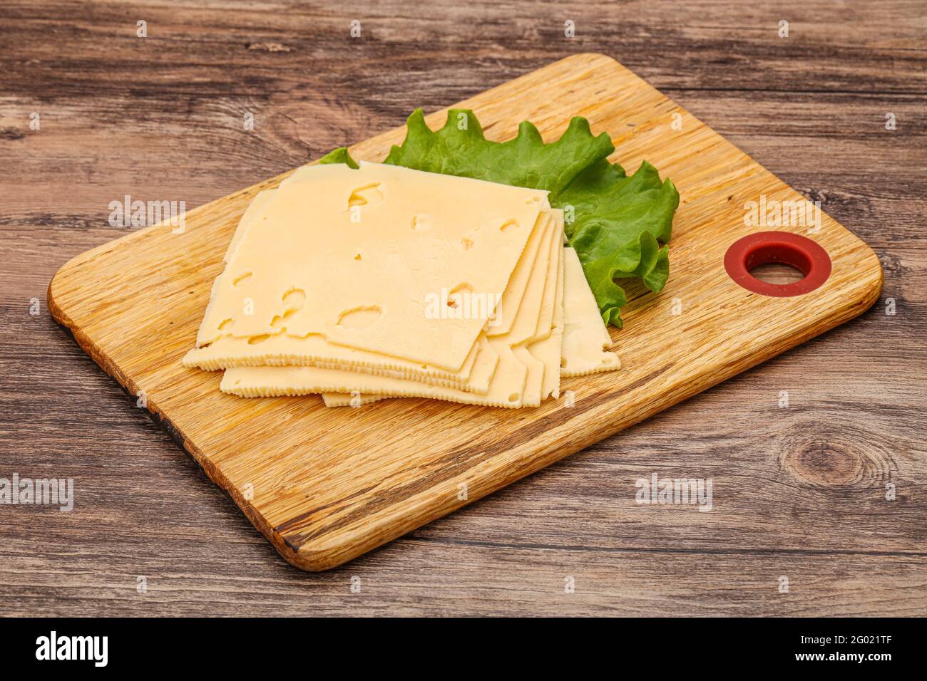 Sliced yellow cheese over salad leaves Stock Photo - Alamy