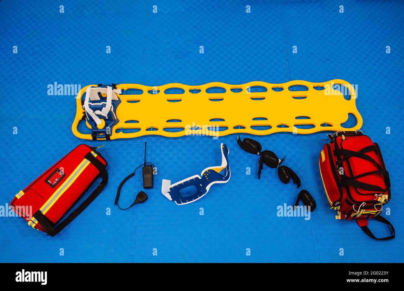 Top view of medical equipment, stretcher, bag and first aid kits on a ...