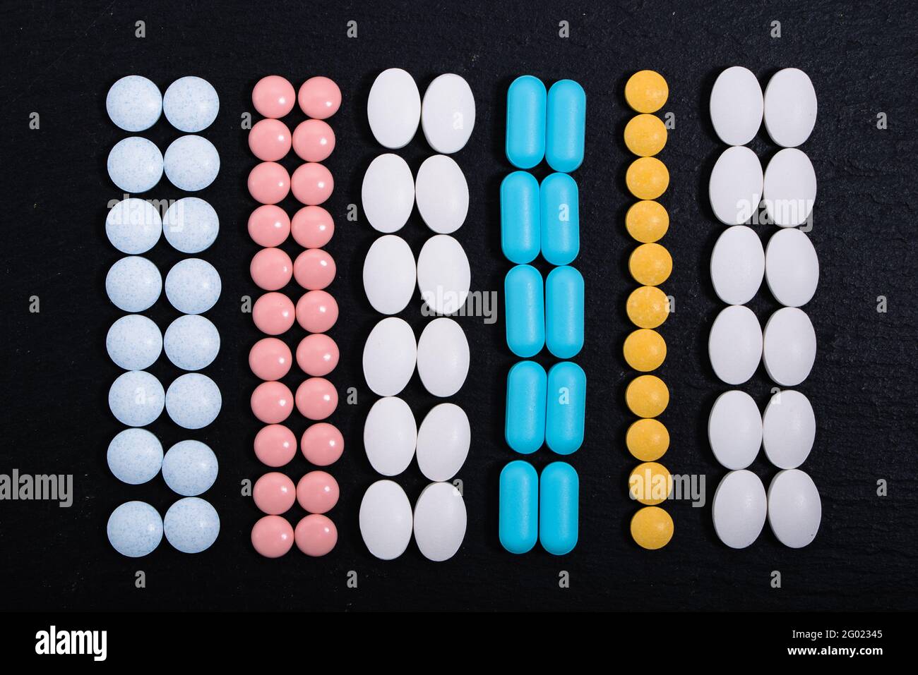 Different medicines. Pills, tablets on black background. Pharmaceutical ...