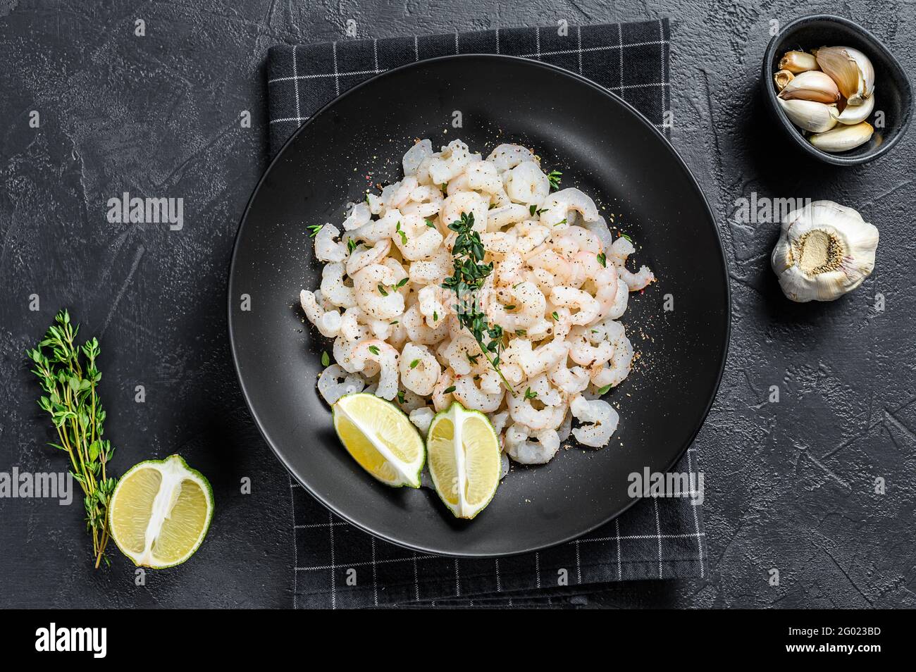 Peeled cooked Shrimps, Prawns in a plate. Black background. top view ...