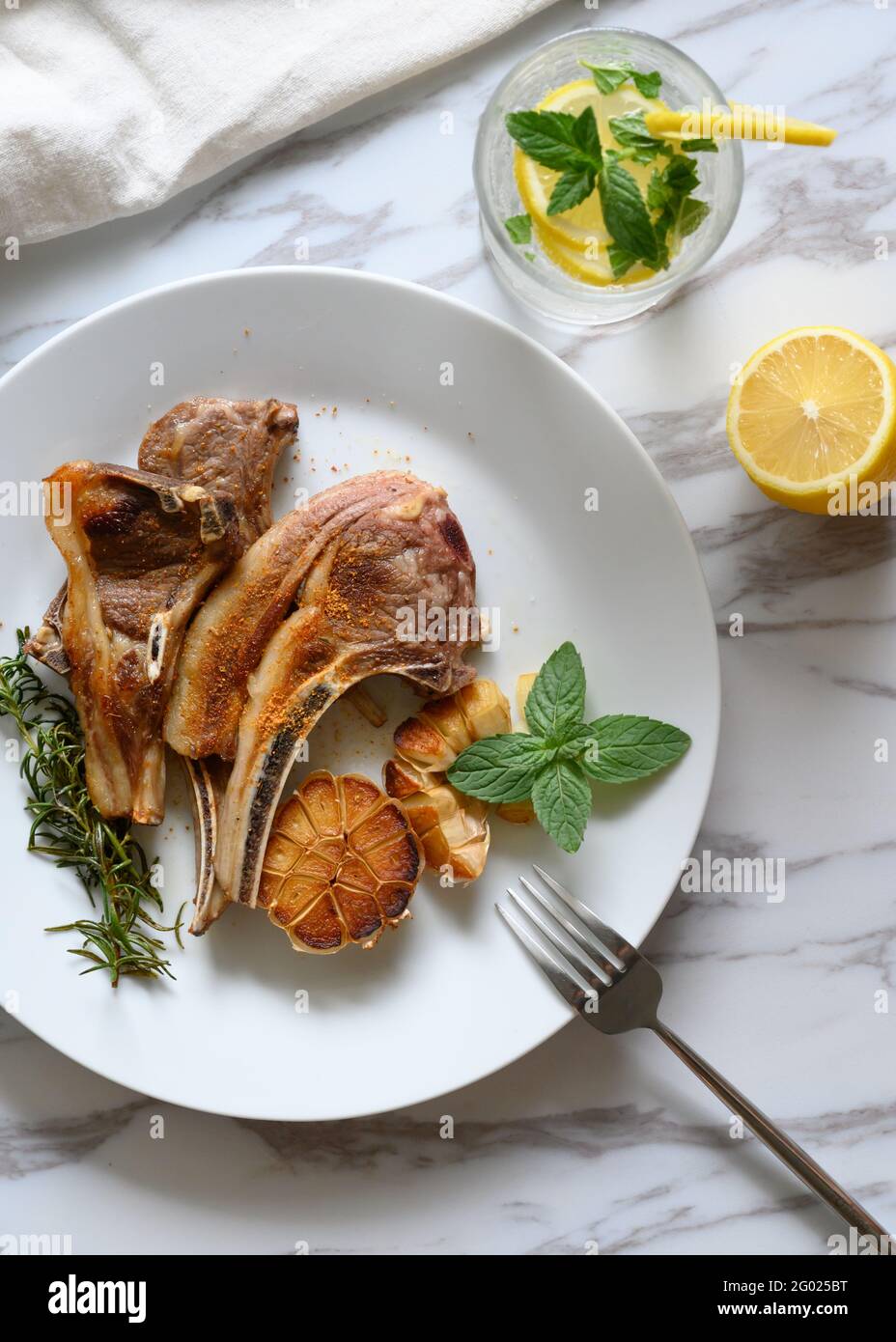 The plate of lamb chops fried until golden brown on the table Stock ...