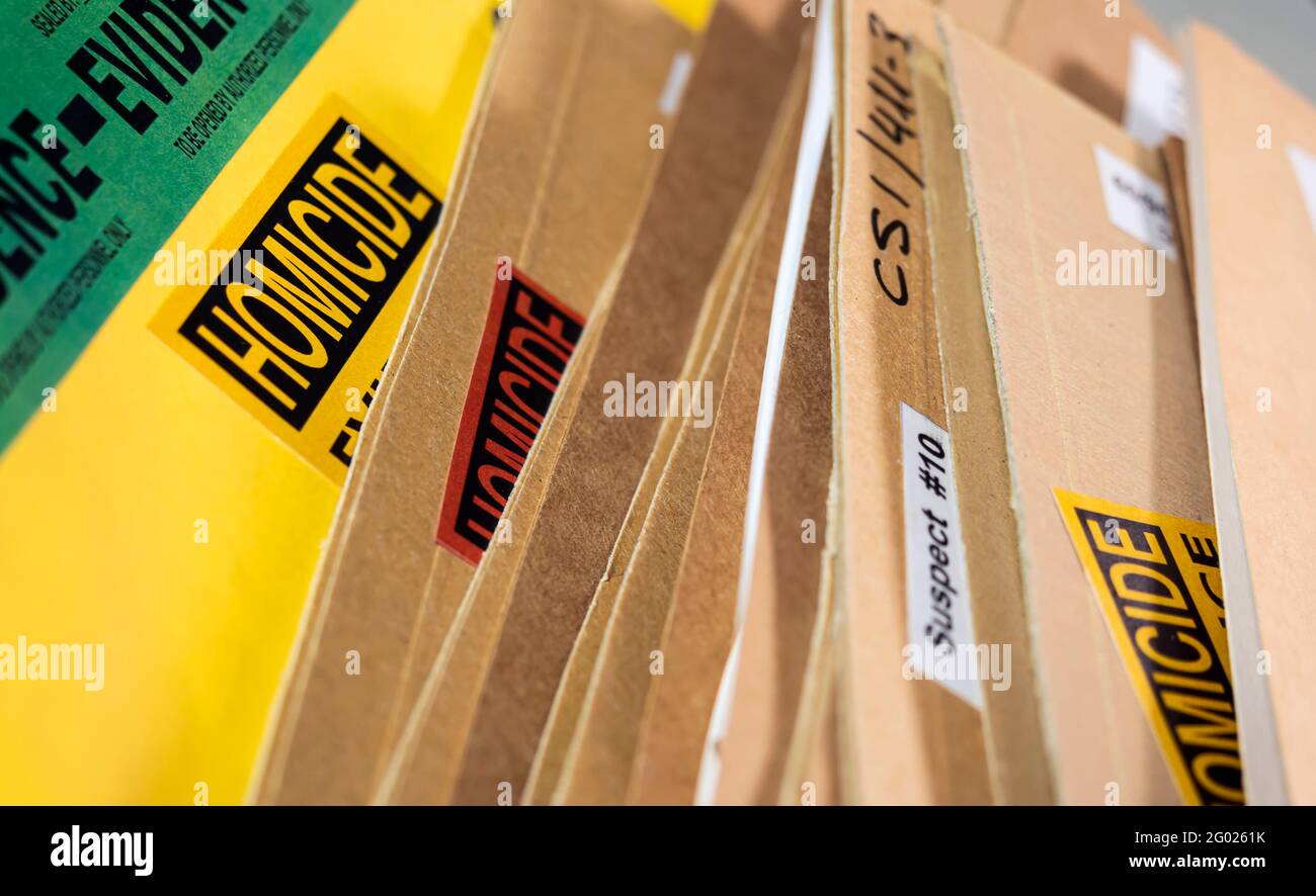 Files and evidence bag in a crime lab, conceptual image Stock Photo - Alamy