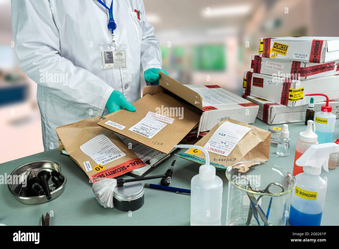 Forensic police check files against evidence in crime lab, conceptual ...