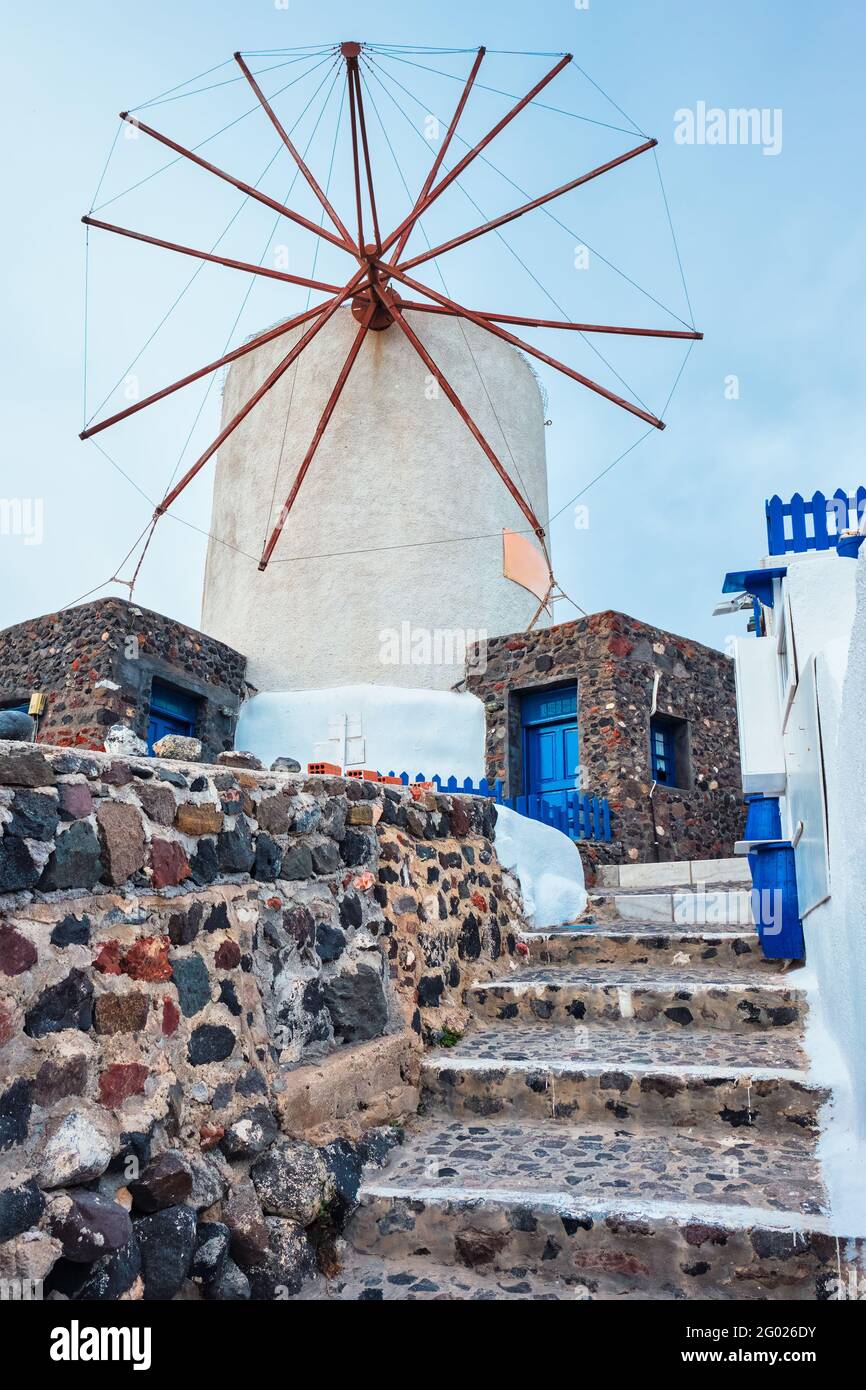 Old greek windmill on Santorini island in Oia town with stairs in ...