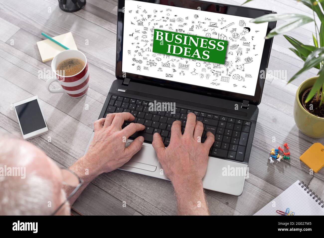 Business ideas concept shown on a laptop used by a man Stock Photo - Alamy