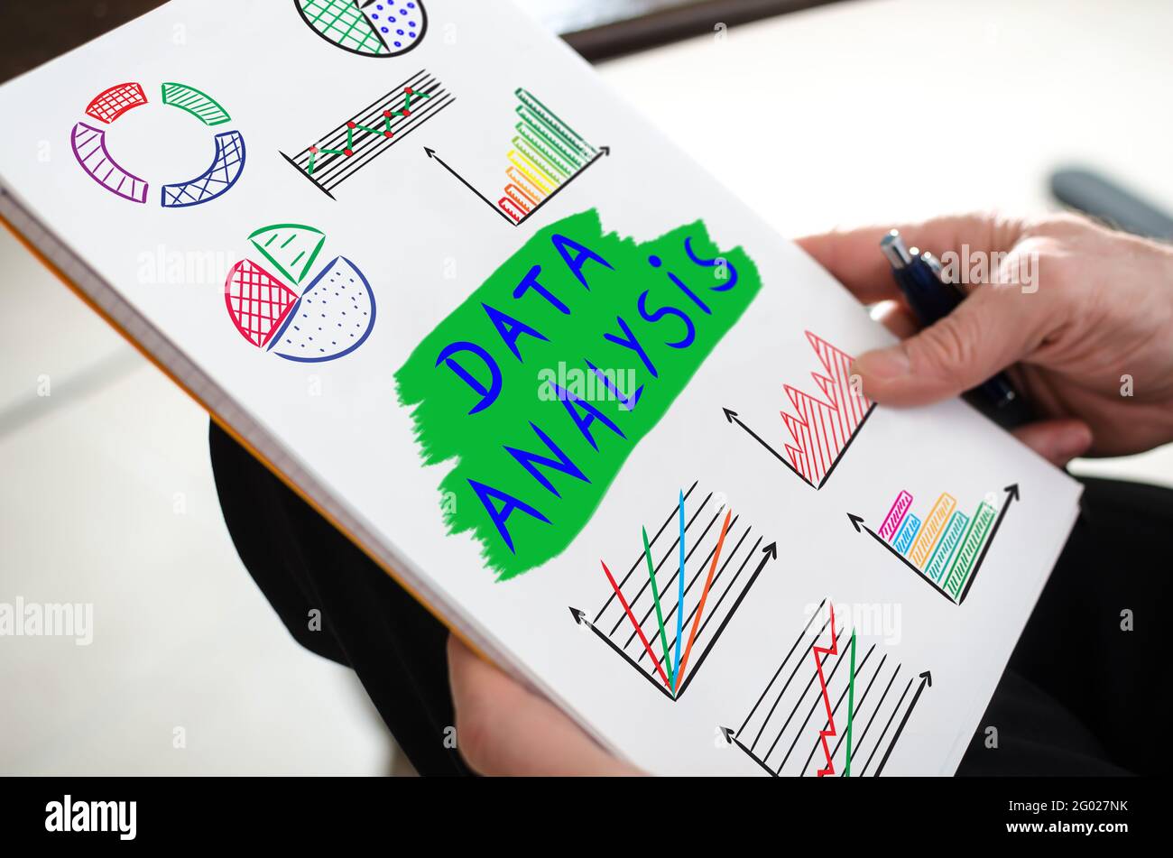 Data analysis concept on a paper held by a hand Stock Photo - Alamy