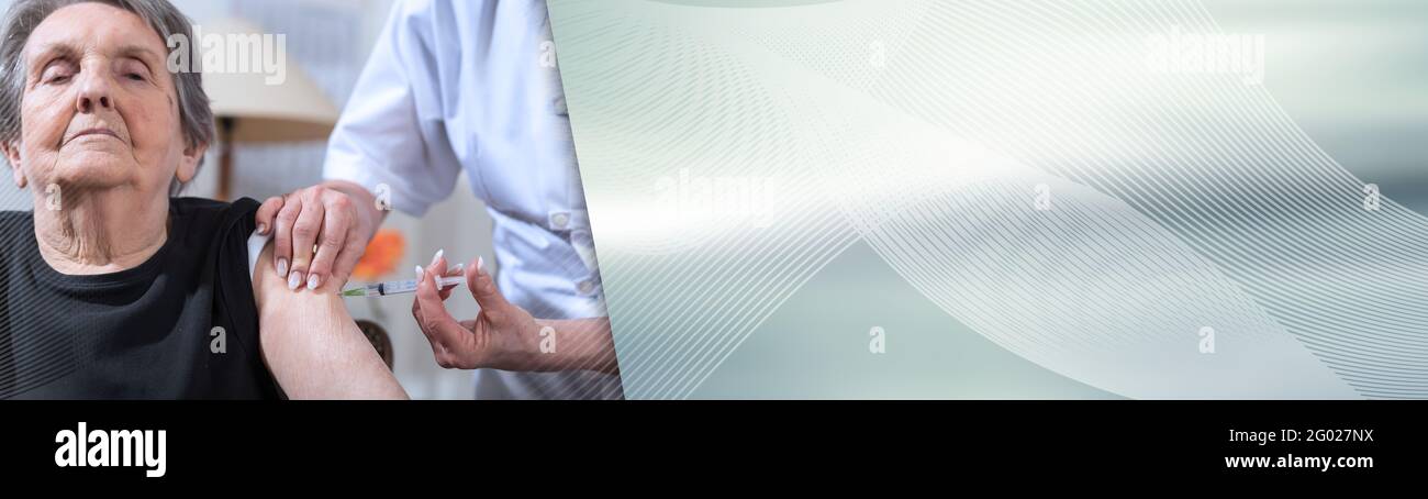 Nurse giving an injection to senior woman. panoramic banner Stock Photo ...