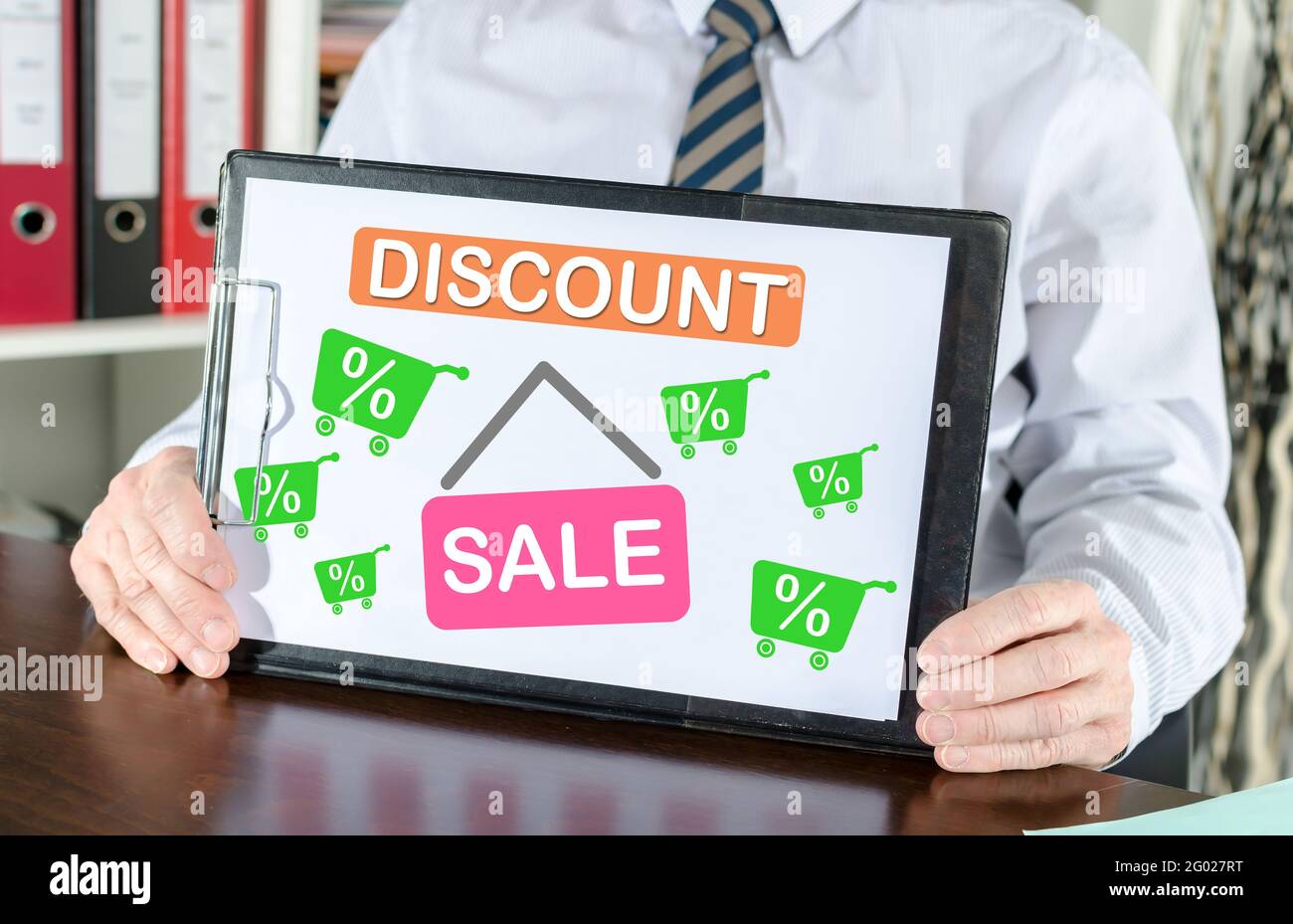Discount concept shown by a businessman Stock Photo - Alamy