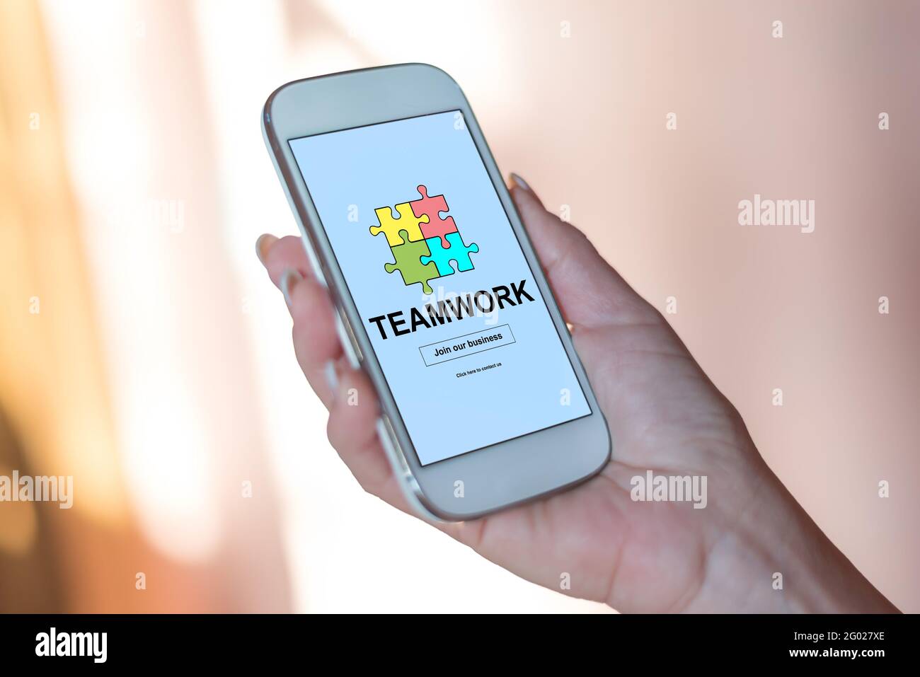 Smartphone screen displaying a teamwork concept Stock Photo - Alamy