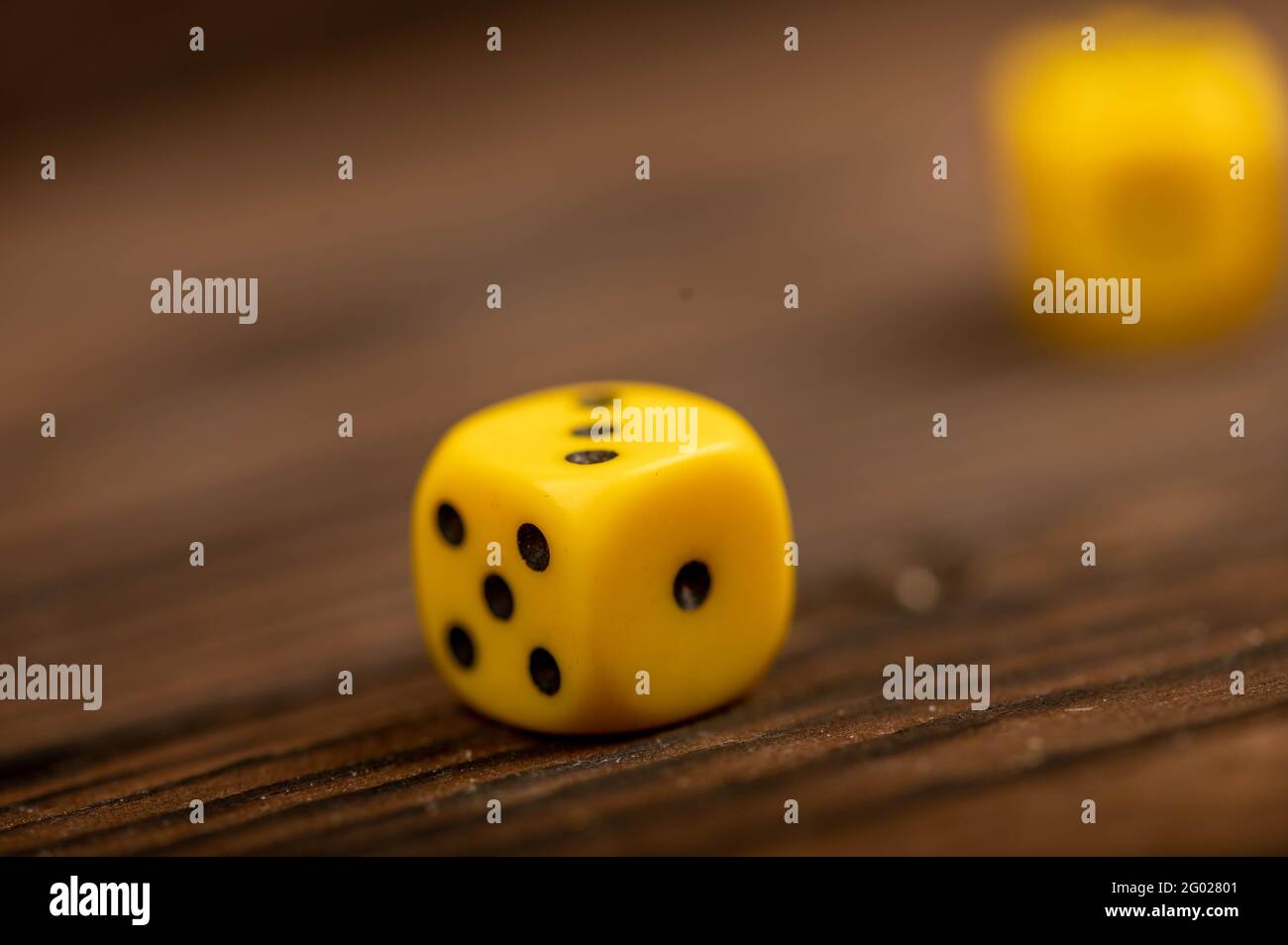 Yellow dice hi-res stock photography and images - Alamy