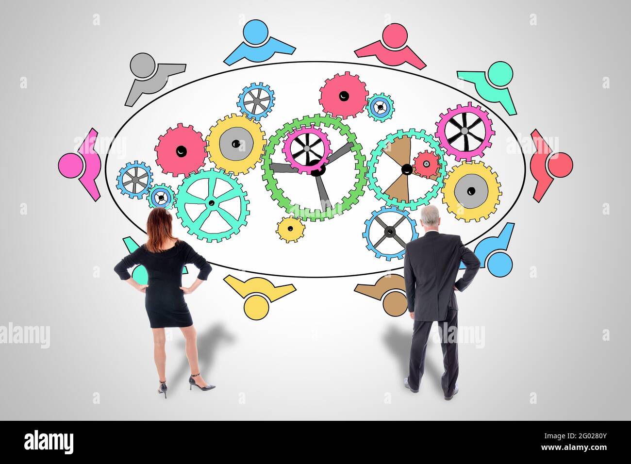 Teamwork concept drawn on a wall watched by business people Stock Photo ...