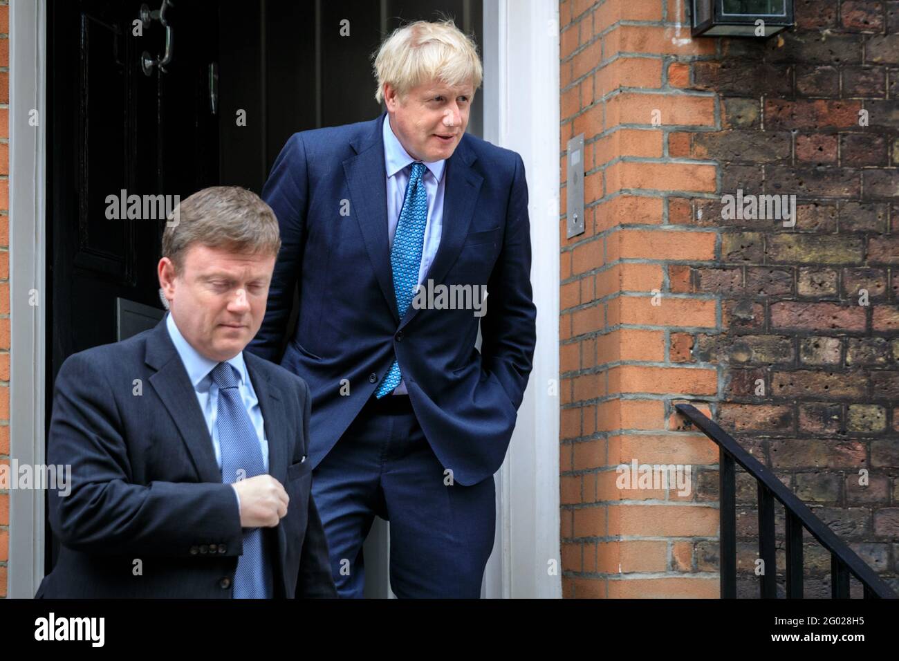 Boris Johnson, MP, with security detail, leaves a house in Great ...