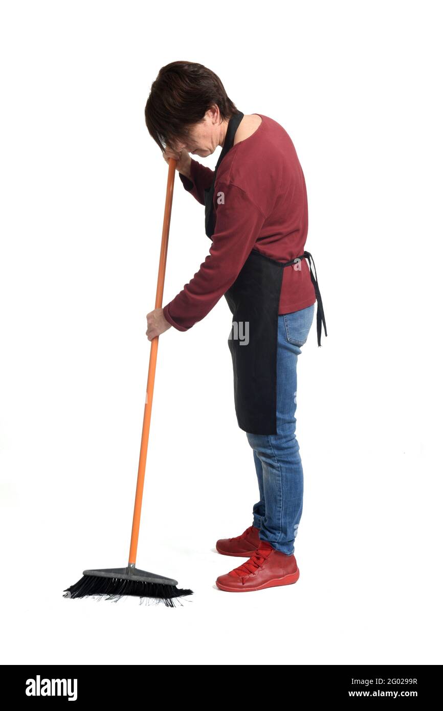 side view of a woman sweeping on white background Stock Photo - Alamy