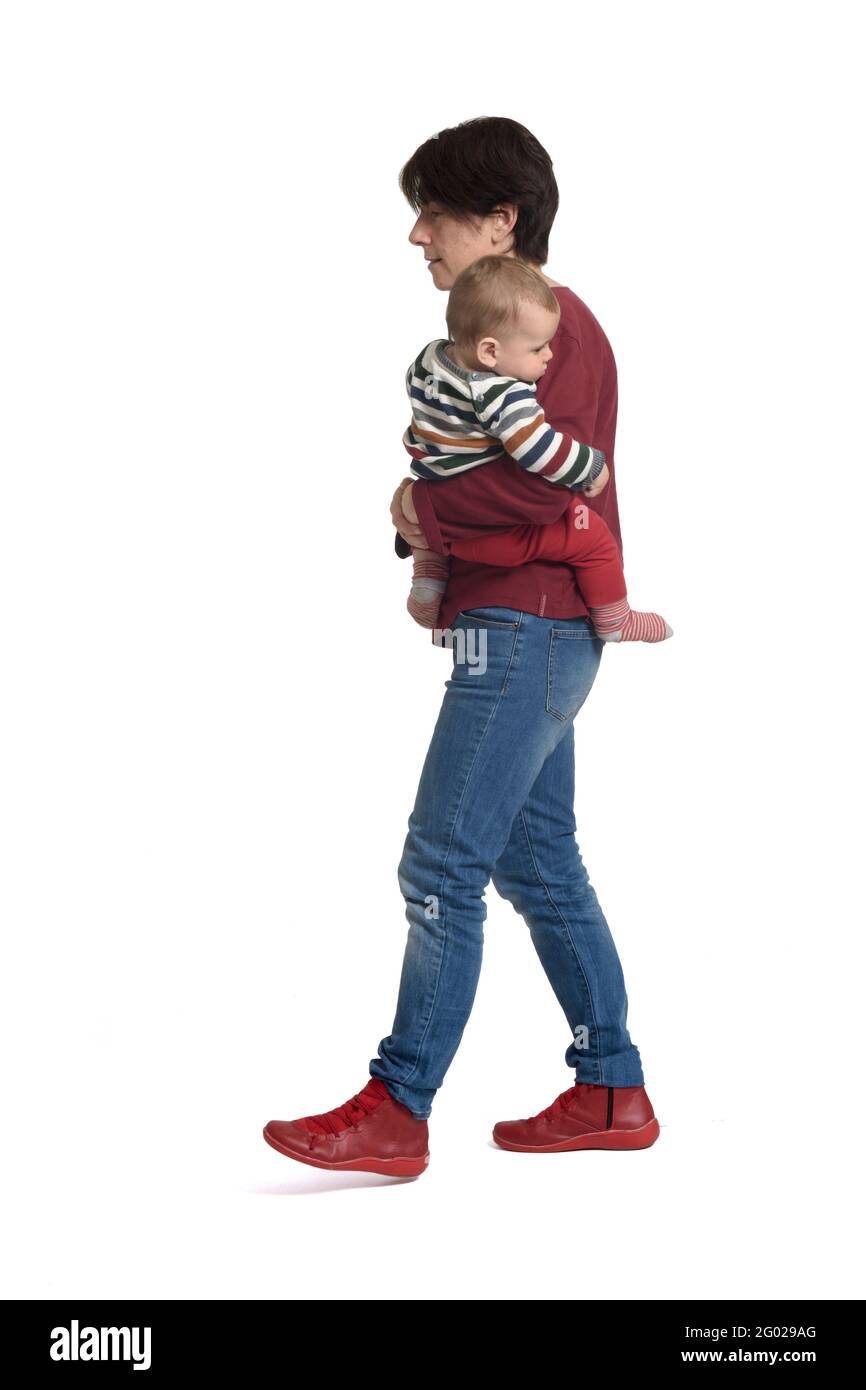 walking of a mother carrying her baby on white background Stock Photo ...