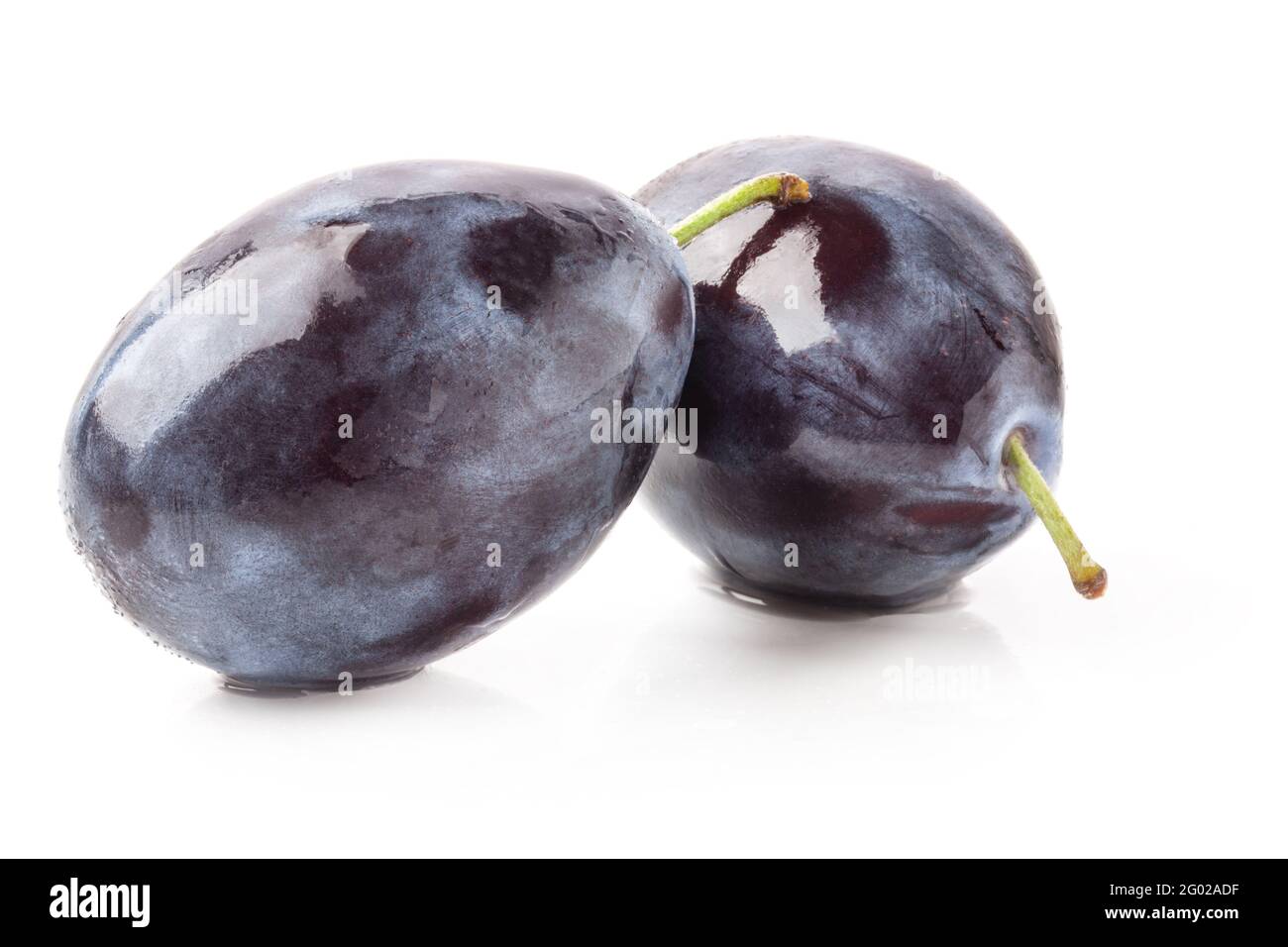 Plums isolated on white background Stock Photo - Alamy