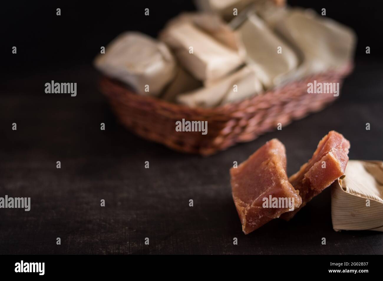 Closeup shot of sweet colombian candy covered with leaves in a little ...