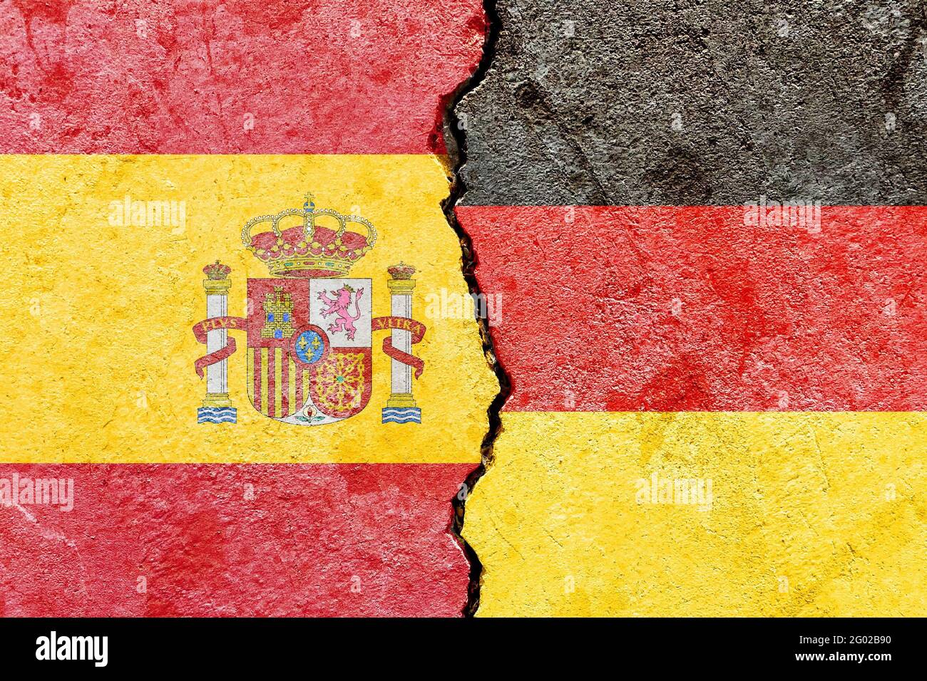 Spain vs Germany national flags pattern isolated on broken cracked wall ...