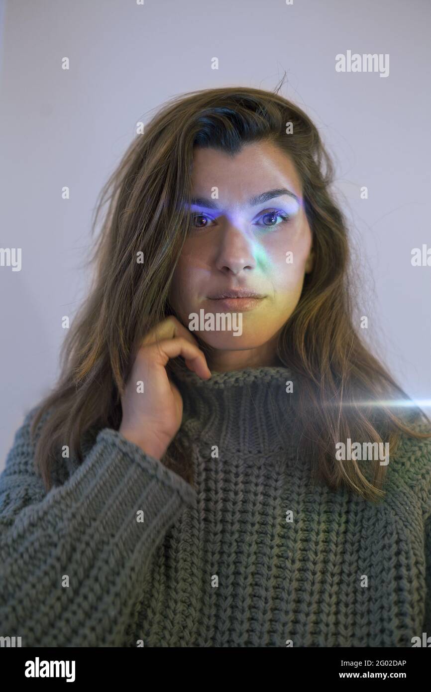 Self-portrait of a beautiful brunette Spanish woman with rainbow shadow ...