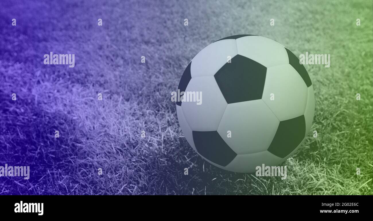 Composition of football on white line on grass pitch with copy space ...