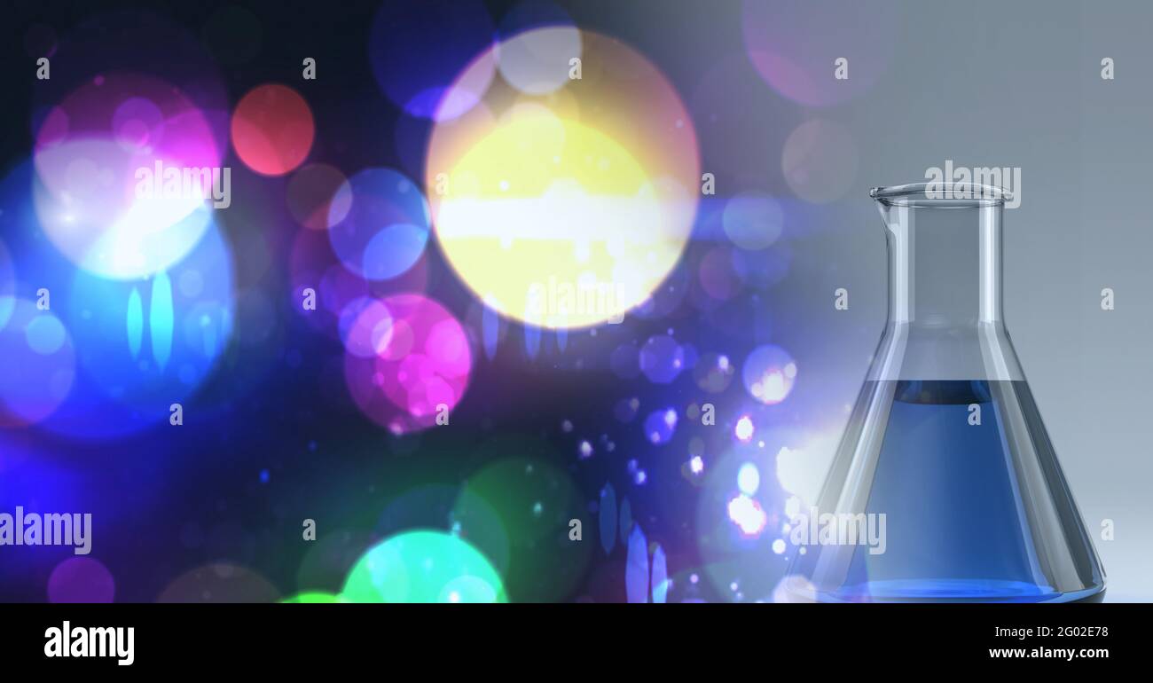 Composition of conical flask of blue liquid, with colourful bokeh copy ...